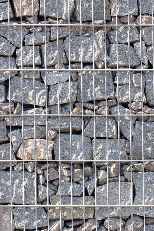 Gabion, a Stone Wall with a Metal Grid of Gray Granite Texture Stock ...