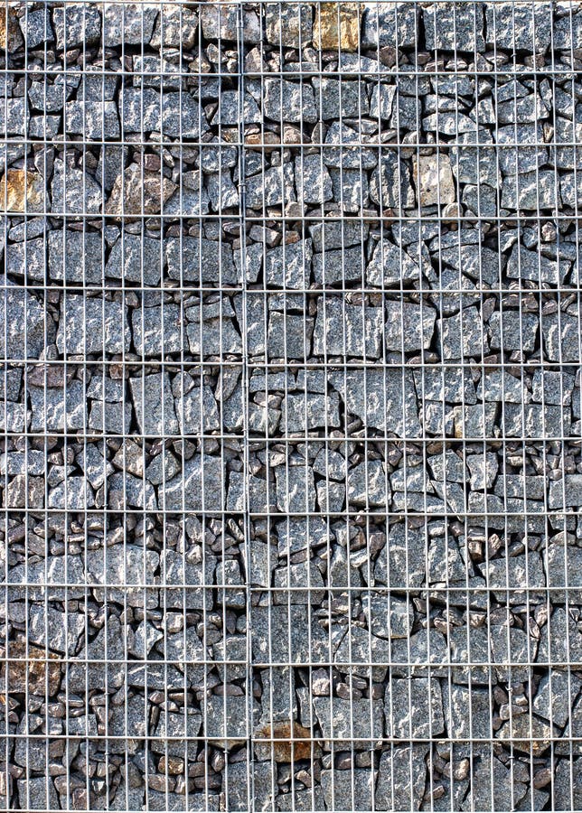Gabion, a Stone Wall with a Metal Grid of Gray Granite Texture Stock ...
