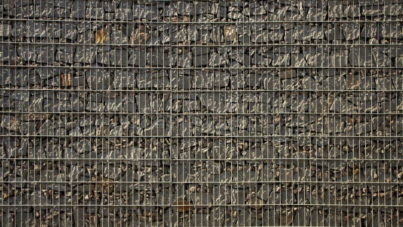 Gabion, a Stone Wall with a Metal Grid of Gray Granite Texture Stock ...