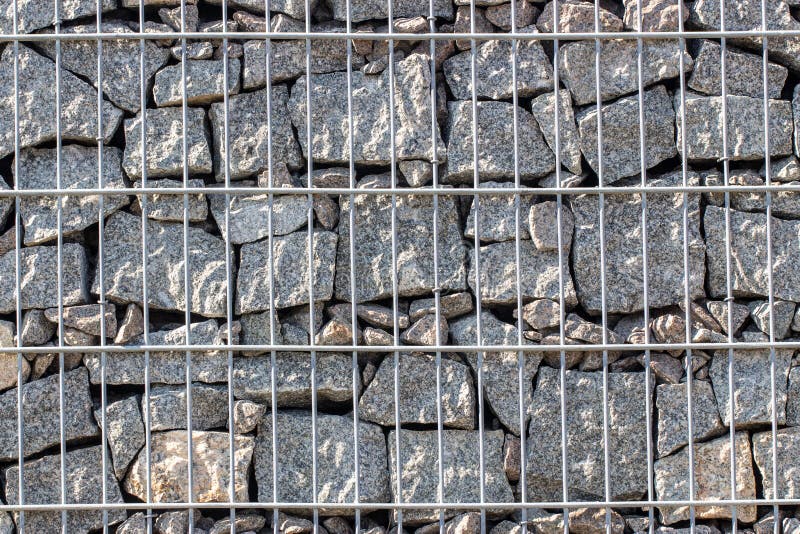 Gabion, a Stone Wall with a Metal Grid of Gray Granite Texture Stock ...