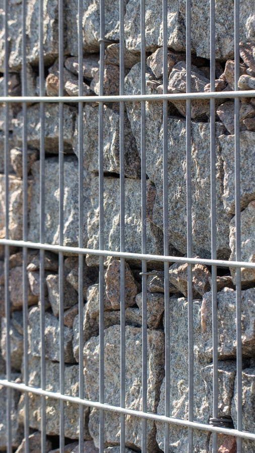 Gabion, a Stone Wall with a Metal Grid of Gray Granite Texture Stock ...