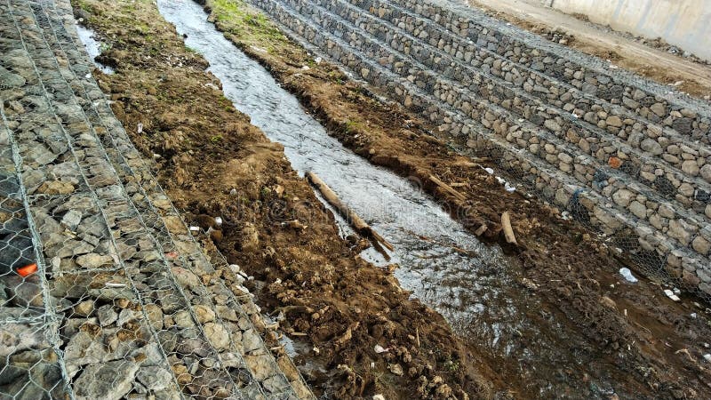 Gabion Wall Construction Along an Eroding Riverbank Stock Photo - Image ...