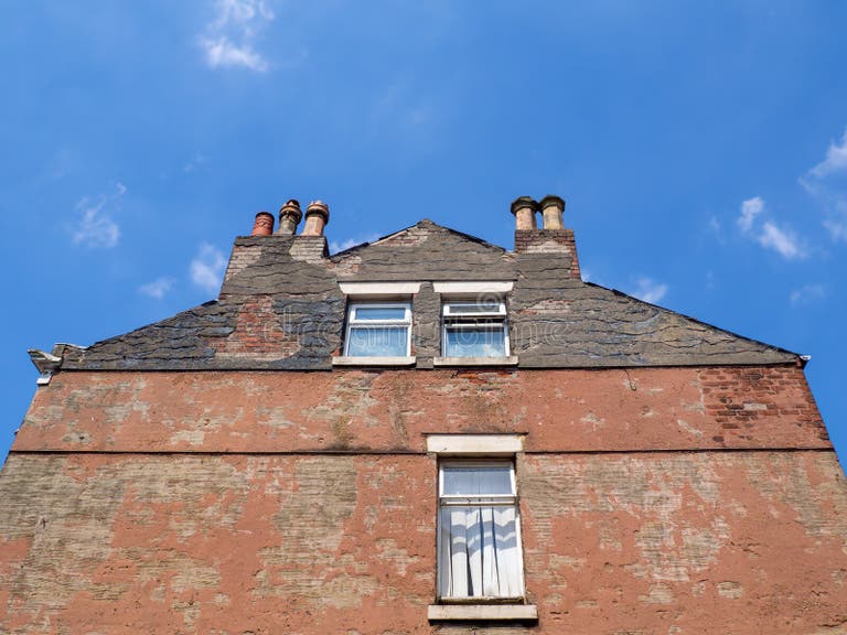 End of an Old House with Peeling Paint, Concrete Cladding and Brickwork ...