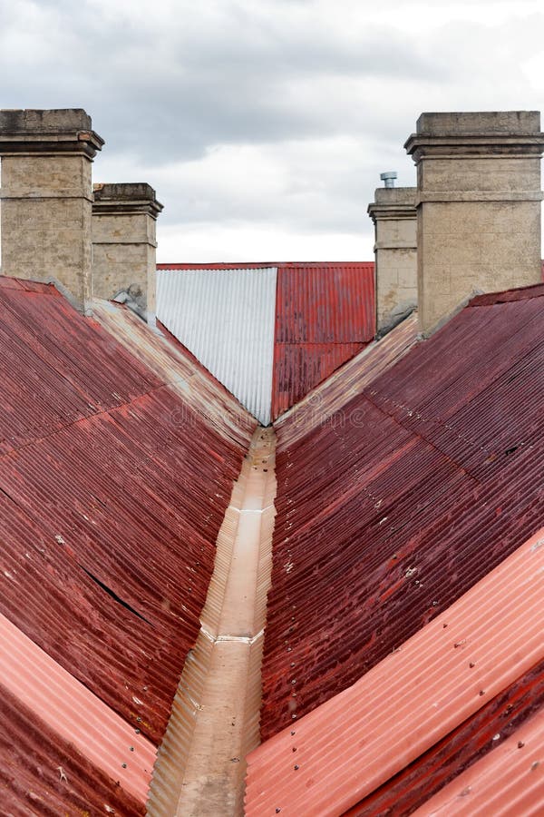 Gable Roof of New and Old Rusty Sheets of Corrugated Iron Stock Image ...