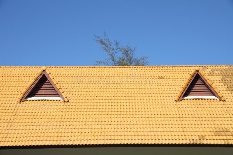 Gable on the yellow roof stock image. Image of panel - 22210679