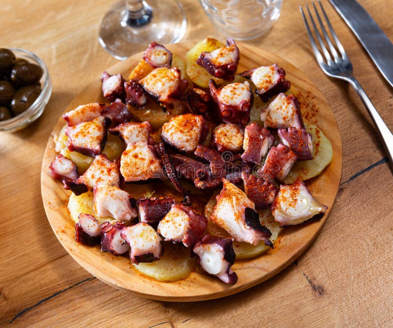 Galician Octopus Served with Potatoes on Plate Stock Image - Image of ...