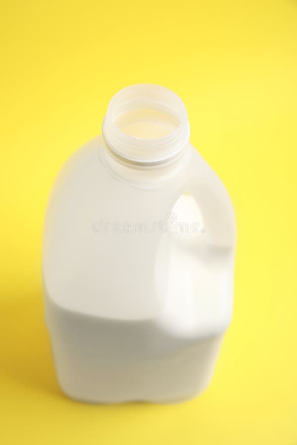Gallon Bottle of Milk on Yellow Background Stock Photo - Image of ...