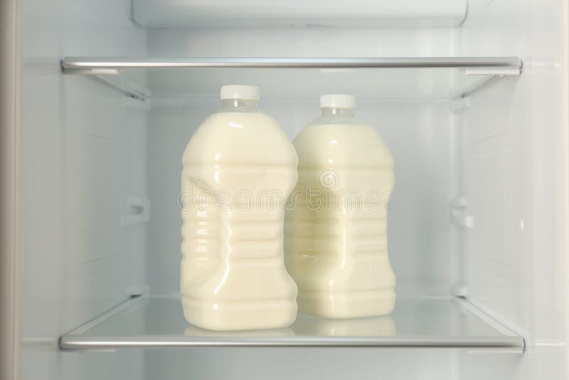 Gallons of Fresh Milk in Refrigerator, Closeup Stock Photo - Image of ...