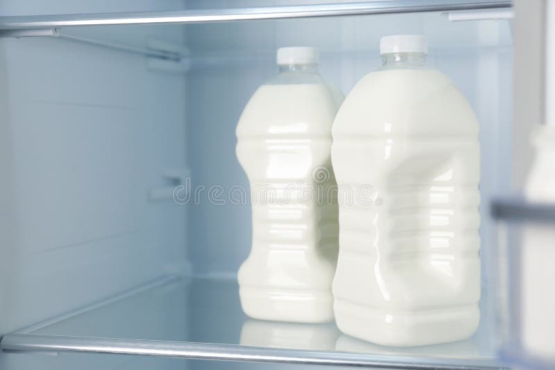 Gallons of Fresh Milk in Refrigerator, Closeup. Space for Text Stock ...