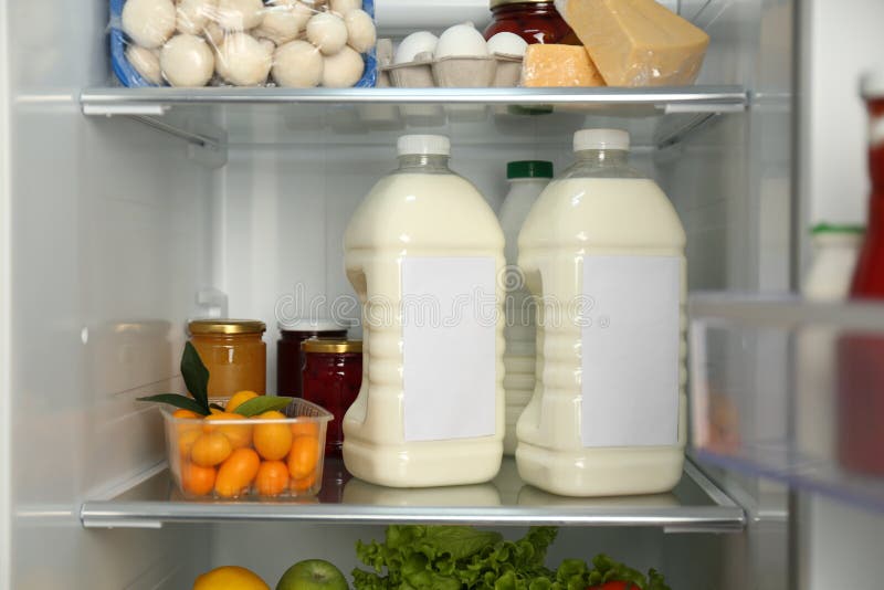 Gallons of Milk in Refrigerator, Closeup. Space for Text Stock Image ...