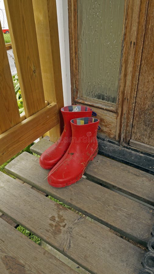Galoshes on the porch stock image. Image of windows, railing - 45994951