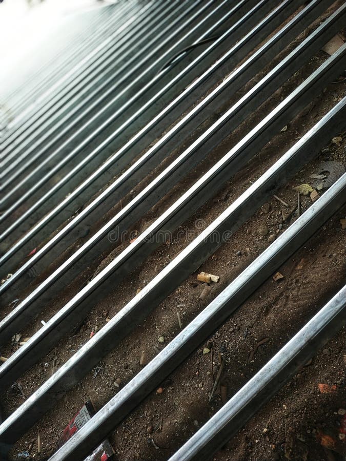 Galvanized Hollow Iron Fence Stock Photo - Image of line, vehicle ...