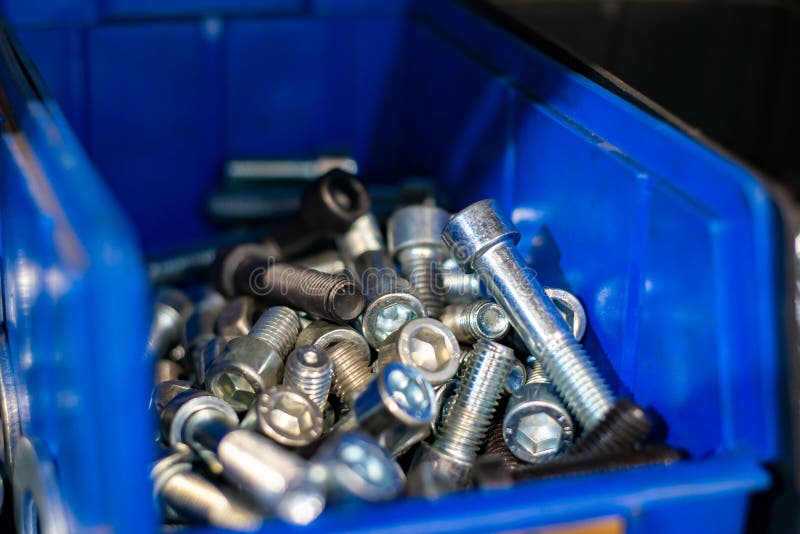 Galvanized Steel Bolts, Screws, Nuts in a Blue Plastic Box on a Rack in ...