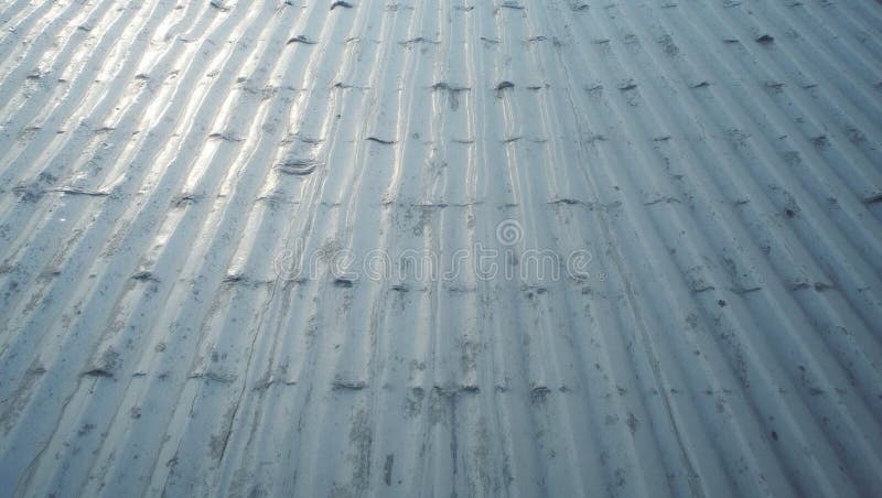 Galvanized Steel Sheet with Repetitive Ridges and Valleys Shining Under ...