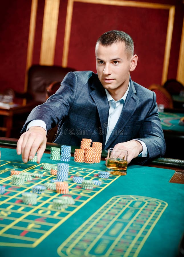 Gambler Playing Roulette at the Casino Stock Photo - Image of game ...