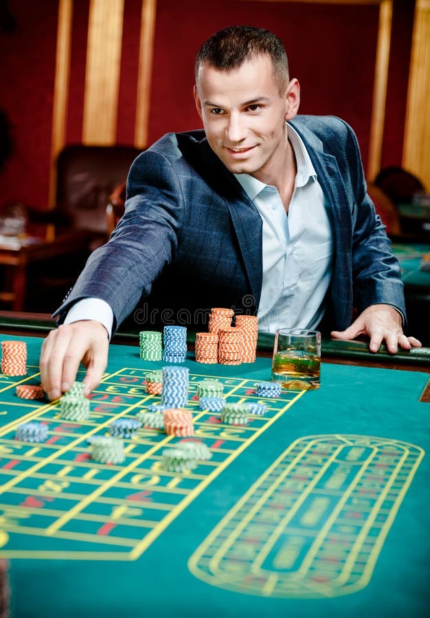 Gambler Stakes Playing at the Casino Table Stock Photo - Image of ...