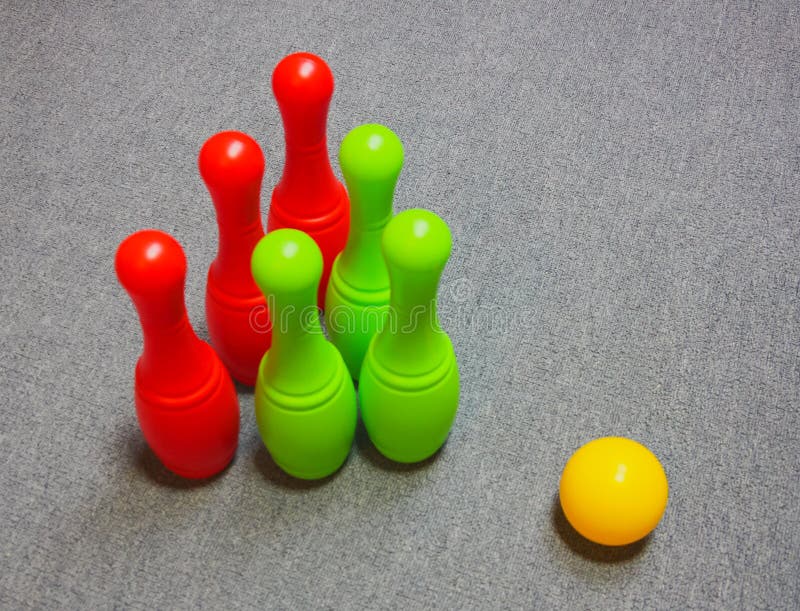 A Game of Bowling. Multicolored Bowling Pins for Children`s Game Stock ...