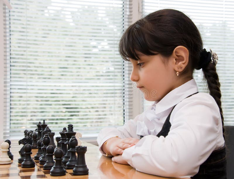 Girl playing big chess set stock image. Image of winner - 194757