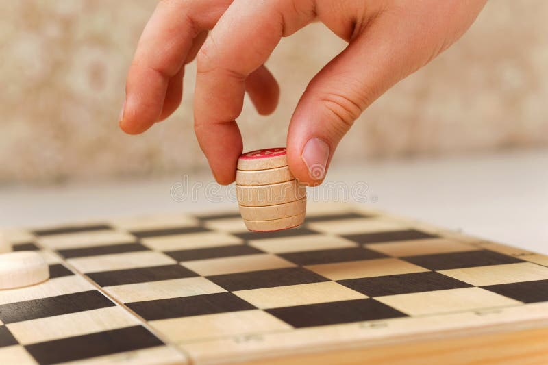 Game Chip in Hand Over a Chess Field Stock Image - Image of chessboard ...