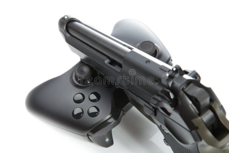 Game Controller and a Real Handgun - Studio Close Up Shot. Virtual and ...