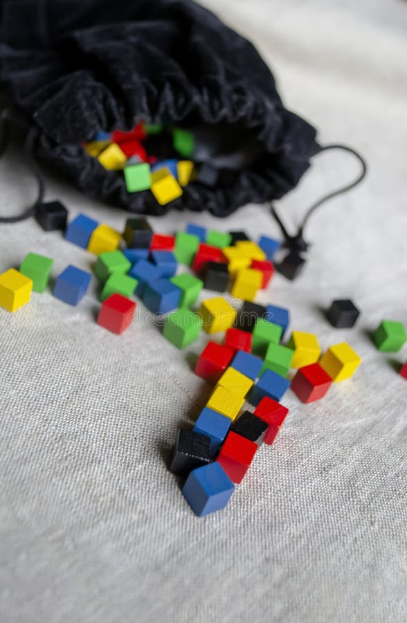 Game Cubes Poured Out of the Black Bag. Lots of Colored Cubes. on the ...