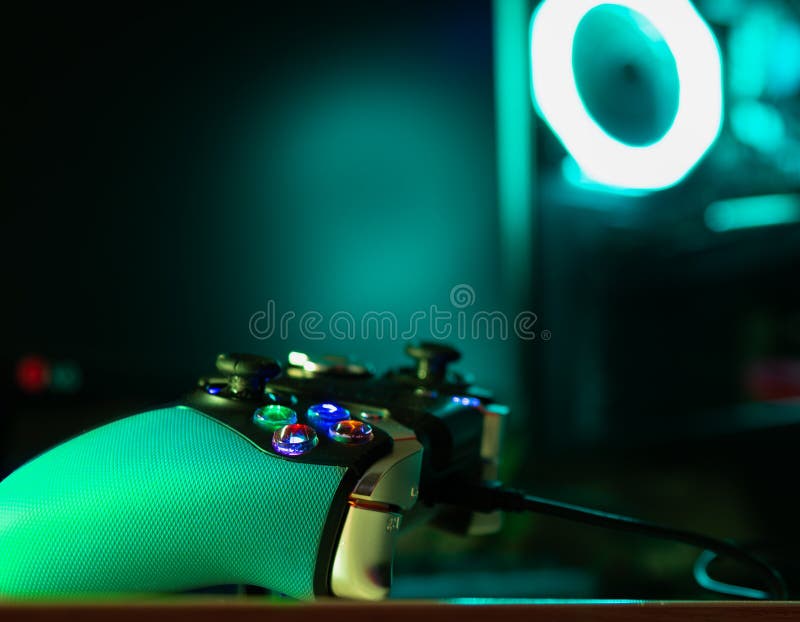 Game Pad and a Glass Pc Case with Turquoise Lighting Stock Image ...