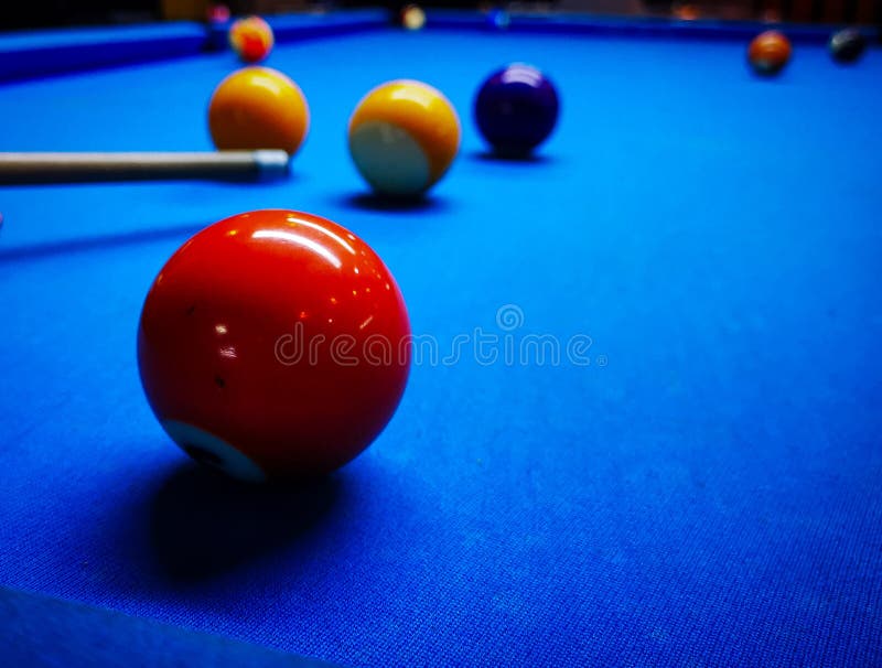 Game of Pool with Multiple Balls and Pool Cue Focus on a Single Ball ...