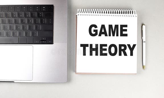 GAME THEORY Text on Notebook with Laptop and Pen Stock Image - Image of ...