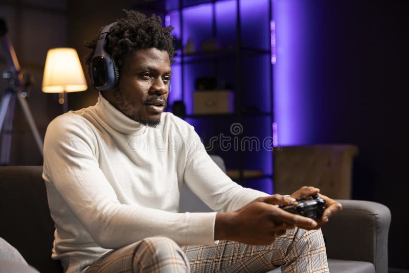 Gamer Battling Rival Players Using Controller, Chatting with Friends ...