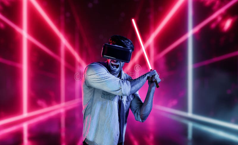 Gamer Holding Laser Sword and Playing Game while Wearing VR Glasses ...