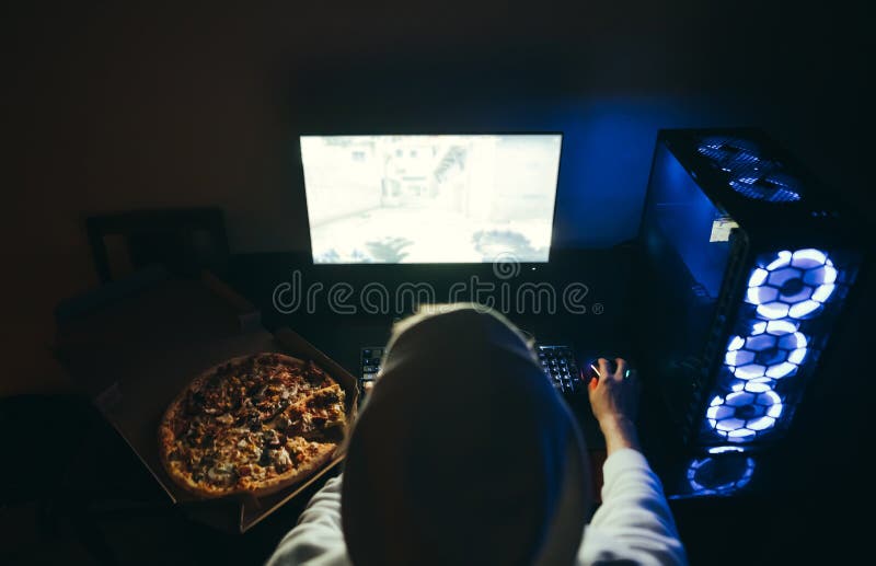 Gamer Plays Video Games on the Computer at Night and Eats Pizza, Top ...