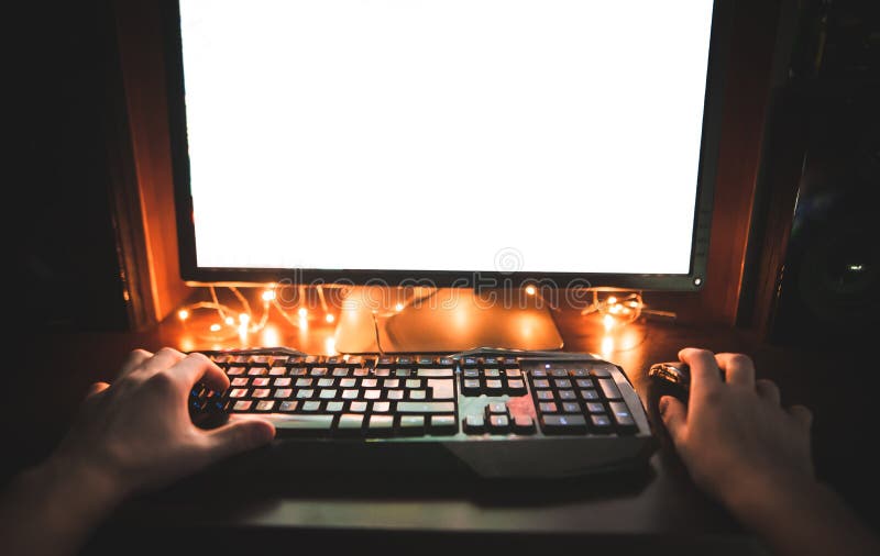 Gamer Plays Video Games at Home on a White Screen Computer. Hands on ...