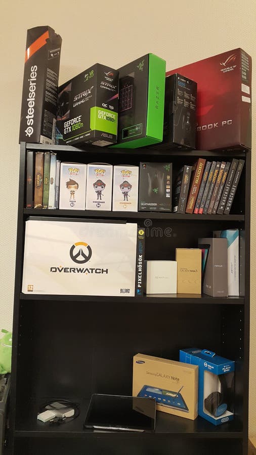 Gamer stuff on a bookshelf editorial stock photo. Image of gamer ...