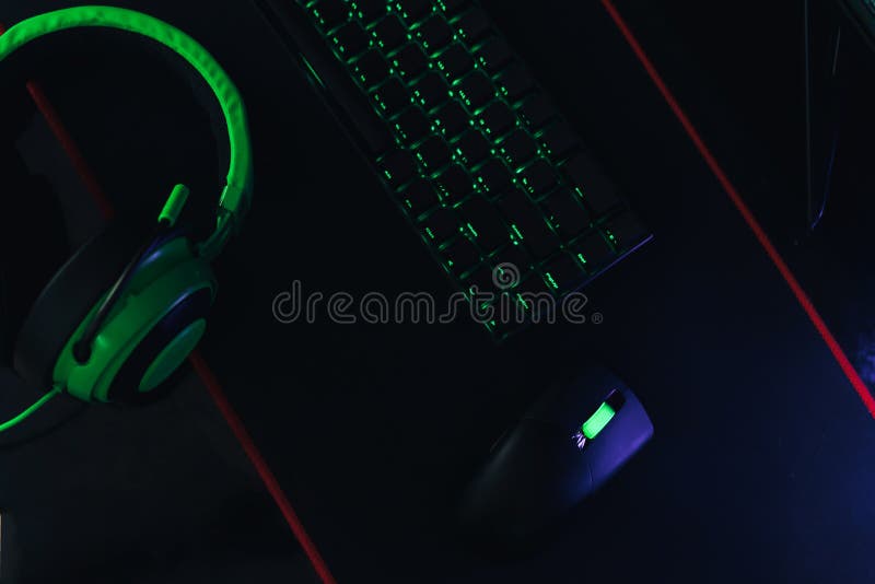 Gaming Accessories with Green Backlight Next To Green Headphones Stock ...