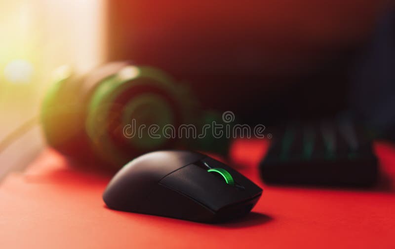 Gaming Accessories with Green Backlight on Red Background Stock Image ...