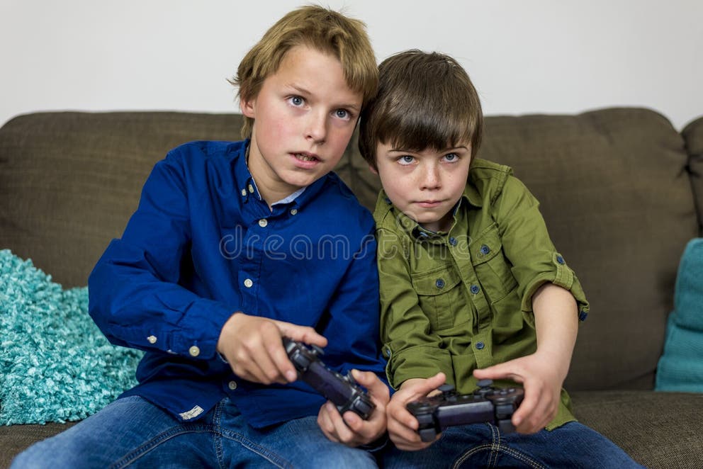 Gaming brothers stock image. Image of gamepad, boys, competition - 52393229