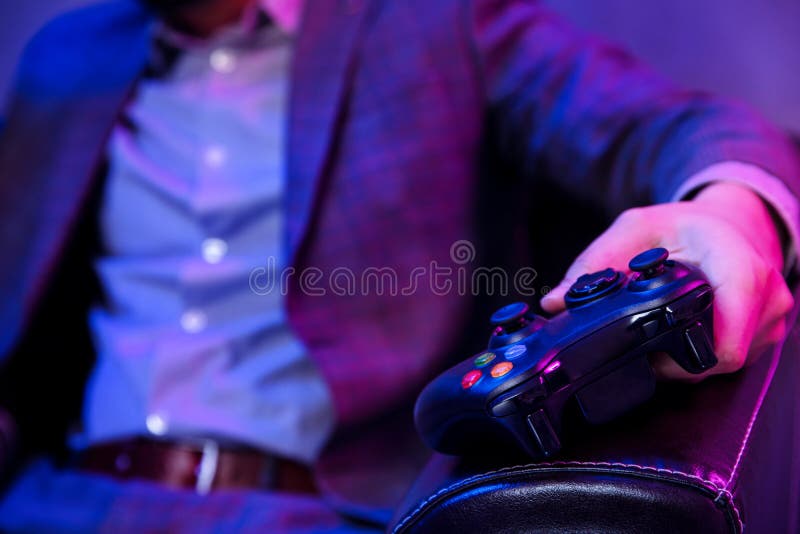 Gaming controller in hand stock image. Image of earning - 183039643