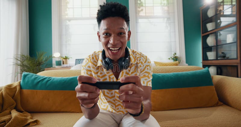 Gaming, Controller and Winner with Man on Sofa for Celebration ...