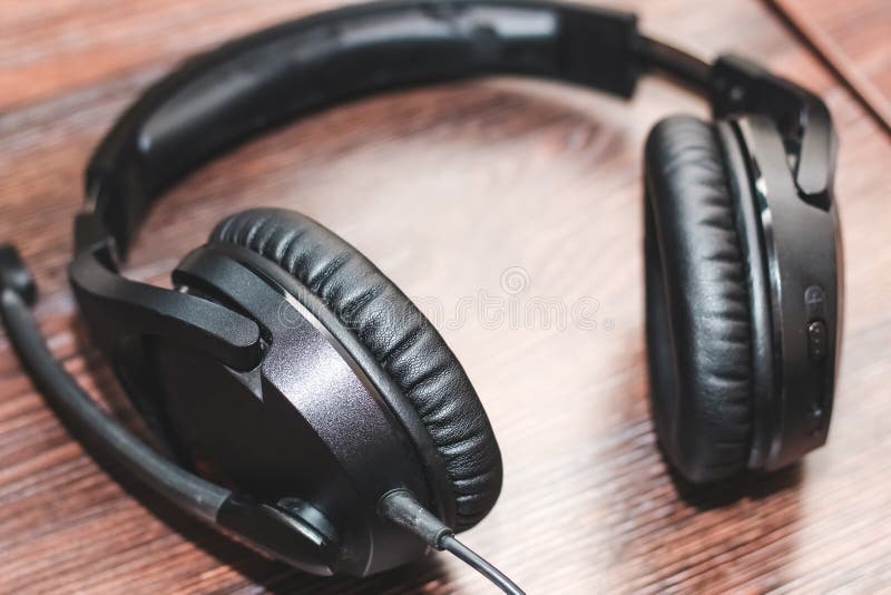 Gaming Headphones with a Microphone Headset on the Table. Stock Image ...