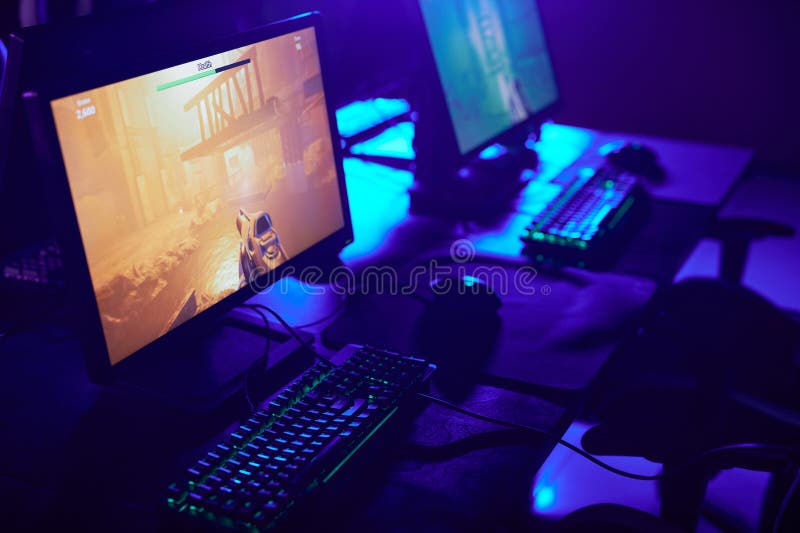 Gaming Setup with Neon Lights and Video Game on Computer Screen Stock ...
