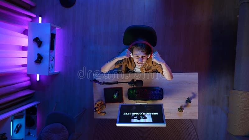 Top View of Man at the Computer, Won the Mission in the Game, Looking ...