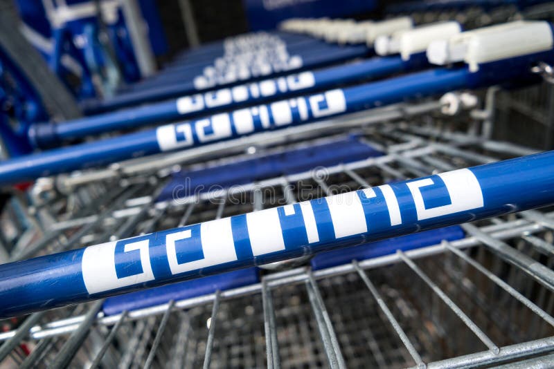 Gamma shopping carts editorial photography. Image of company - 121069762