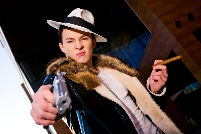 Gangster with a Gun and Cigar Aiming at Camera Stock Image - Image of ...