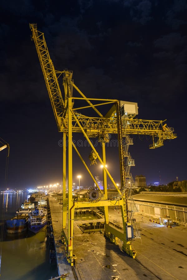 Gantry Crane in Port at Night Time. Yellow Crane and Dark Sky Stock ...