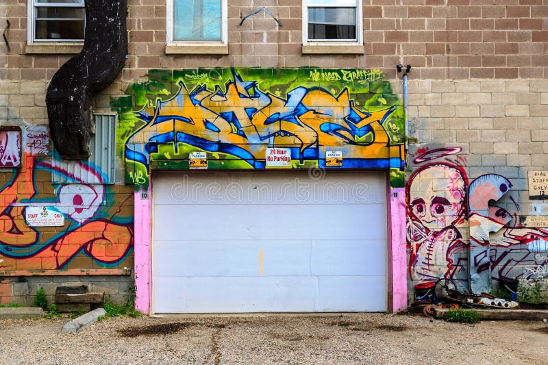 A Garage Door with Graffiti on it Editorial Stock Image - Image of ...