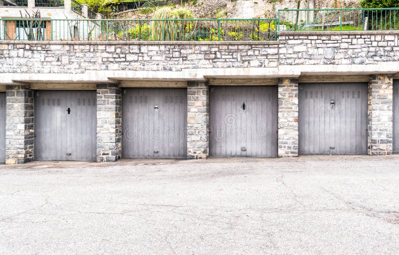 Garage Doors in a row. stock image. Image of doors, entrance - 70841313