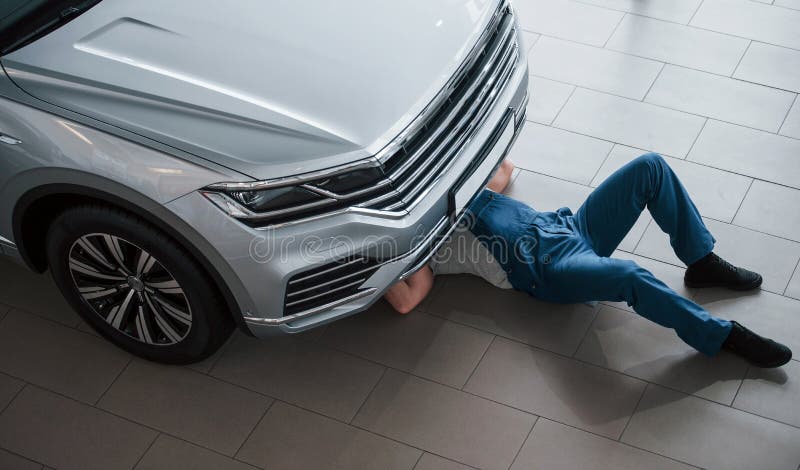 In Garage. Man in Blue Uniform Works with Broken Car Stock Image ...