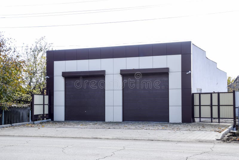 Garage for Two Cars with Roller Shutter. Modern Gate in the Garage with ...