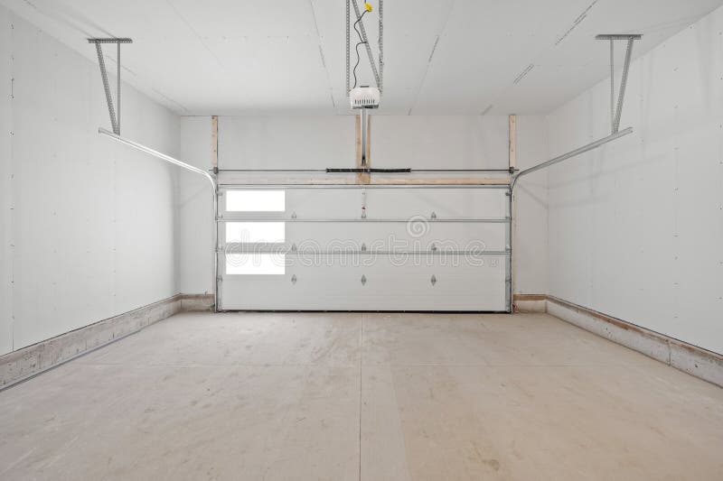 Garage with a White Door and a Garage Door Opener Stock Image - Image ...
