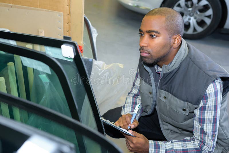 Garage Worker Noting Reference Part Stock Image - Image of vehicle ...